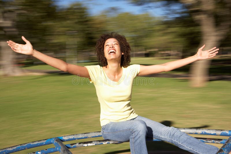 Young Woman Riding on Roundabout in Park Stock Photo - Image of ...