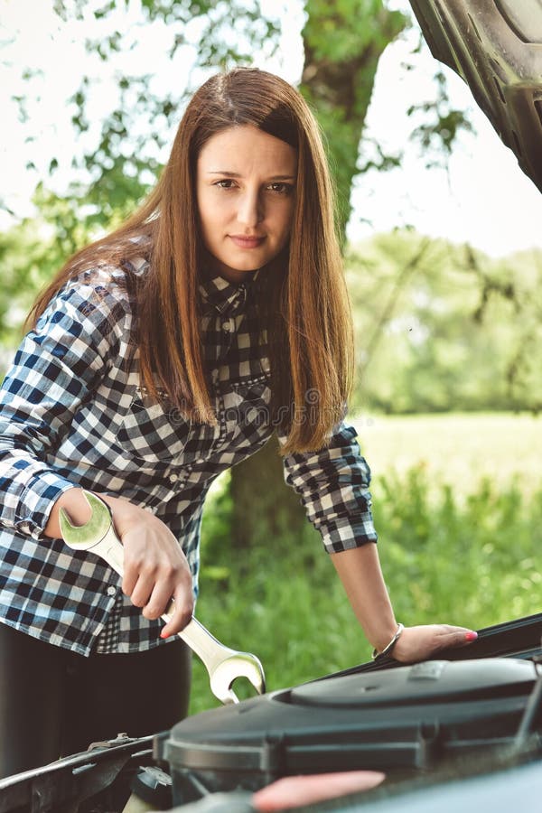 Young Woman by the Roadside after Her Car Has Broken Down. Toned Image ...