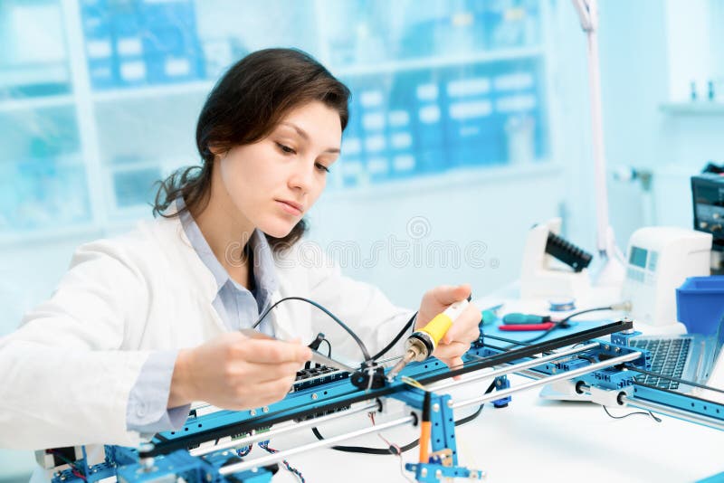 Young Woman in a Robotics Laboratory Stock Photo - Image of equipment ...