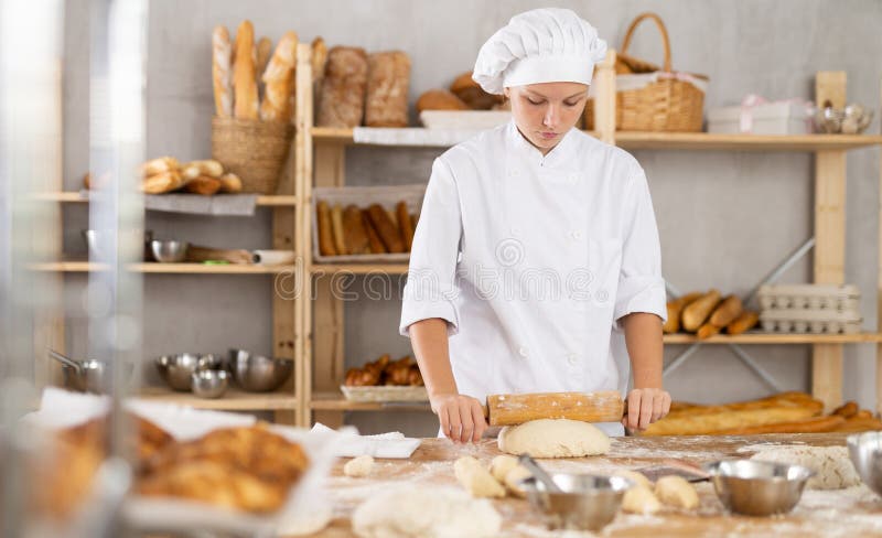Young Woman Rolls Out Dough with Rolling Pin Stock Image - Image of ...