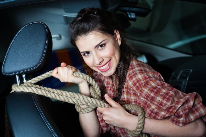 Young Woman with Rope Inside New Car Stock Image - Image of inside ...
