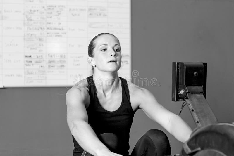 Young Woman on Rowing Machine - Crossfit Workout Stock Image - Image of ...