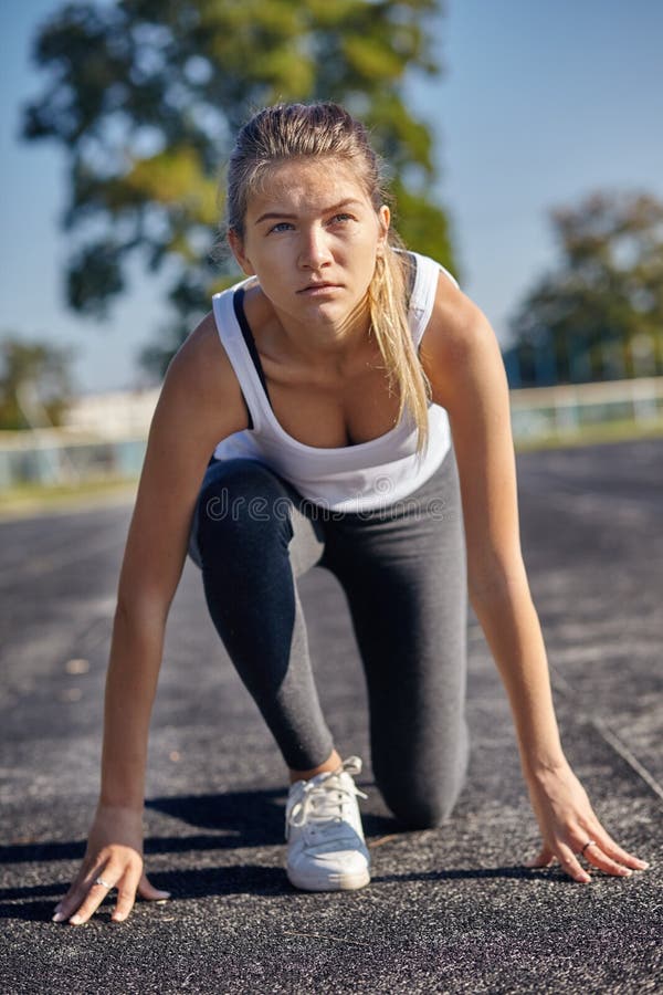 A Young Woman Runner Getting Ready for a Run on Track Stock Photo ...