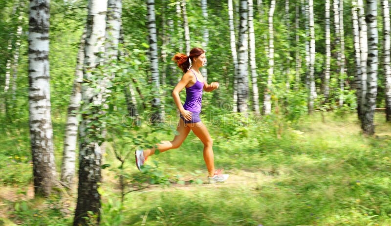 Young Woman Runner in a Green Forest Stock Photo - Image of fast ...