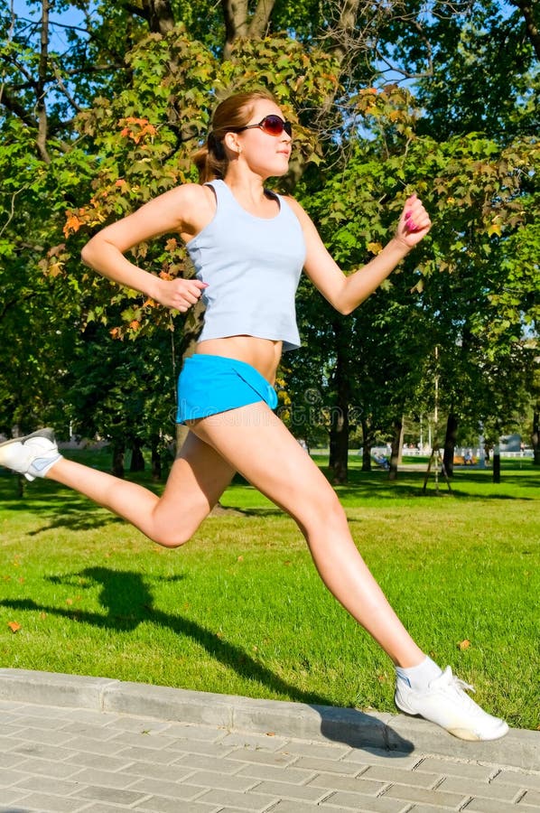 Young woman running stock photo. Image of outdoors, model - 13401060