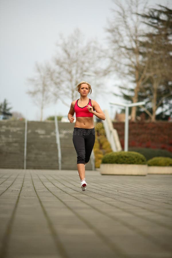 Young woman running stock image. Image of healthy, campus - 4108009