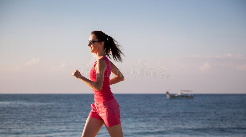 Young Woman Running Along the Coast Stock Image - Image of happy ...