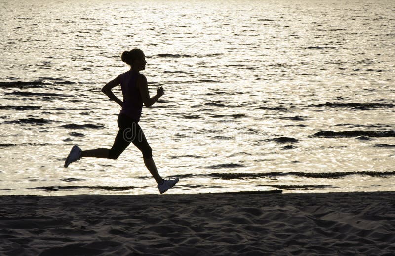Young Woman Running Along Lake Shore Stock Image - Image of horizon ...