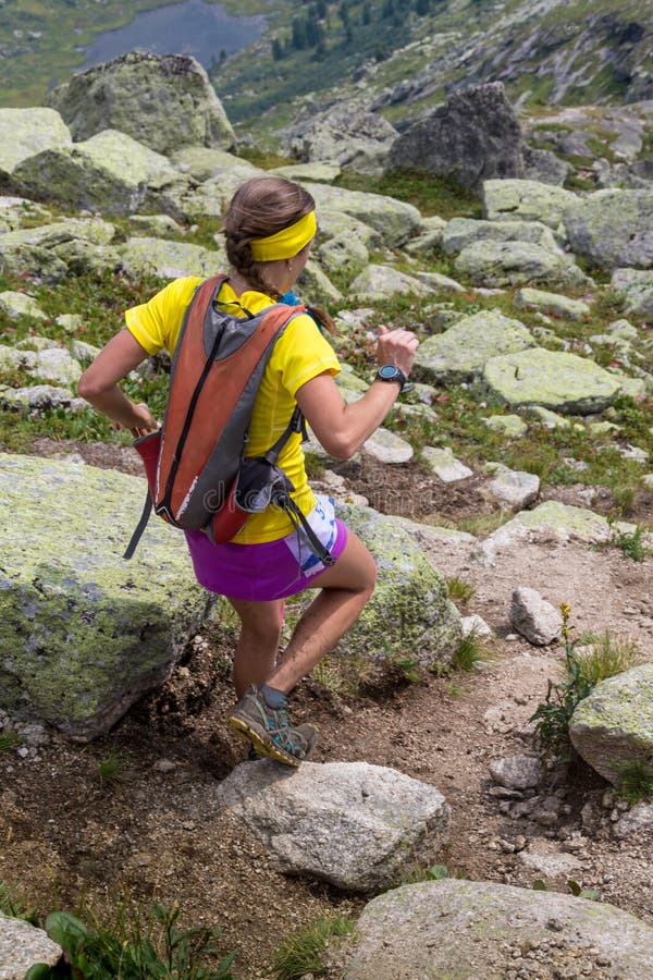 Young Woman Running on a Dry Mountain Path. Stock Photo - Image of ...