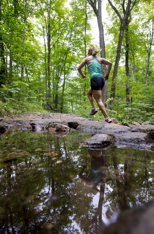 Running in forest stock photo. Image of young, flexibility - 223783698