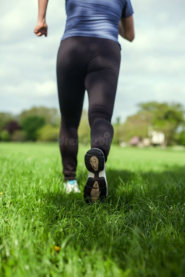 Young Woman Running on the Grass Stock Image - Image of beauty, fitness ...