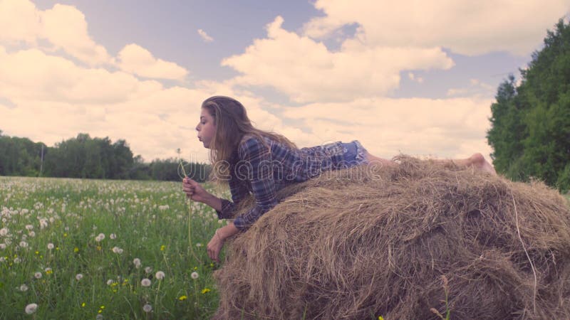 Young Woman Running and Jumping on the Haystack Stock Footage - Video ...