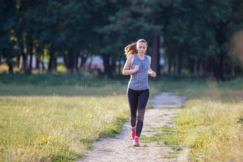 Young Woman Running on the Path in Summer Park Stock Image - Image of ...