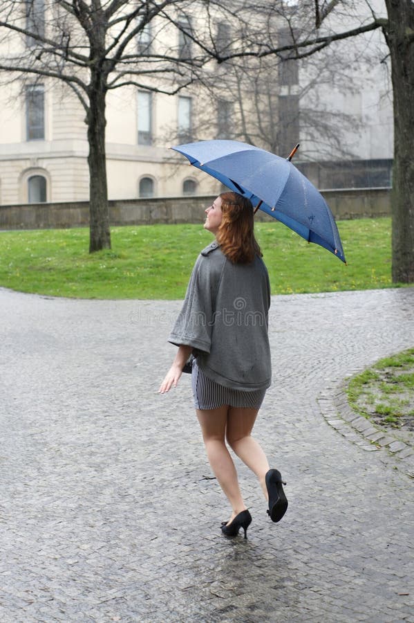 Young Woman Running through the Rain Stock Image - Image of woman ...