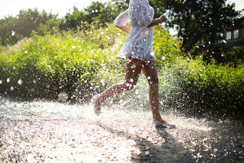 Young Woman Running through the Water at the Beach Stock Image - Image ...