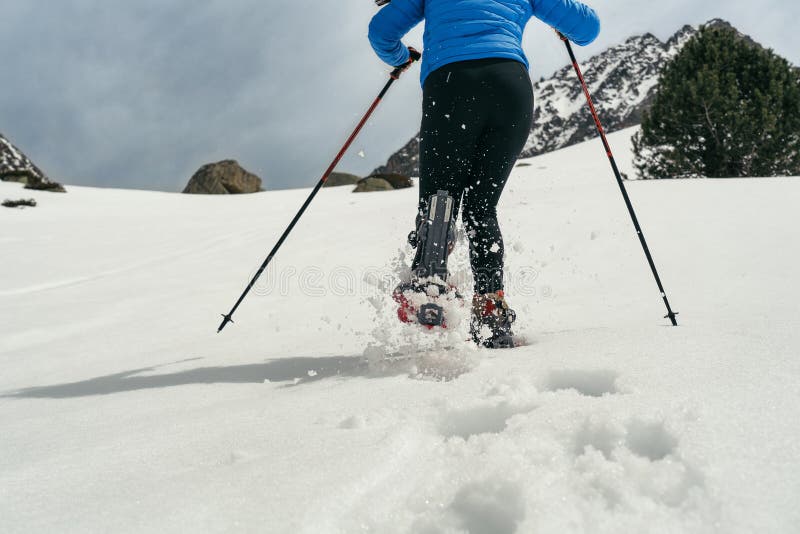 Young Woman Running with Snow Rackets in High Mountain Stock Image ...