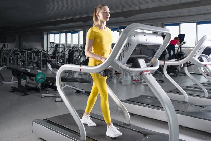 Young Woman Walking on Treadmill in Gym Stock Photo - Image of fitness ...