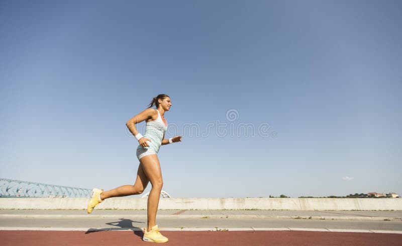 Young woman running stock image. Image of motion, sporty - 56367261