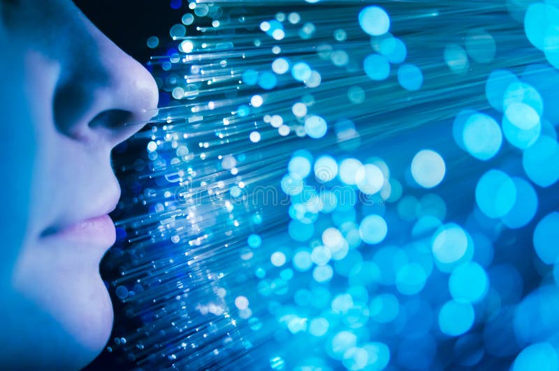 Young Woman`s Face and Blue Fiber Optics Stock Photo - Image of ...