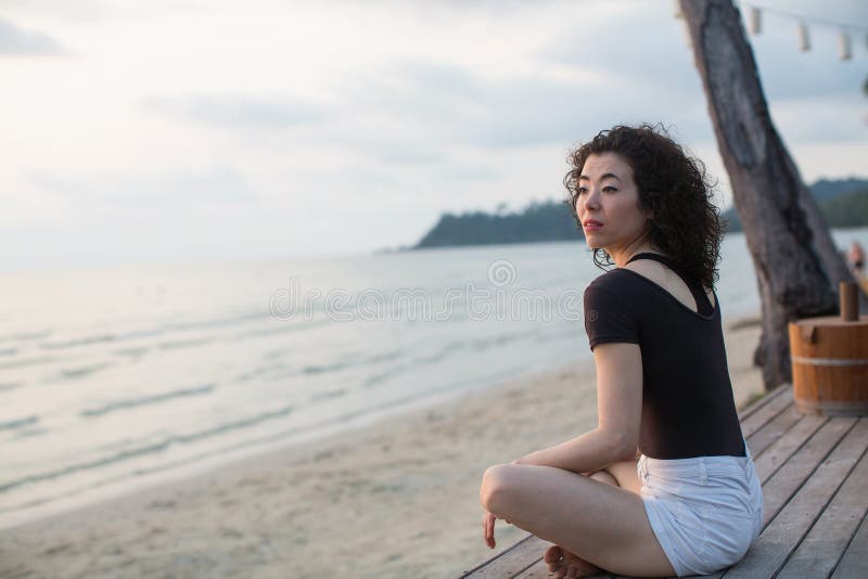 A Young Woman is Sad by the Sea Alone. Stock Image - Image of asia ...