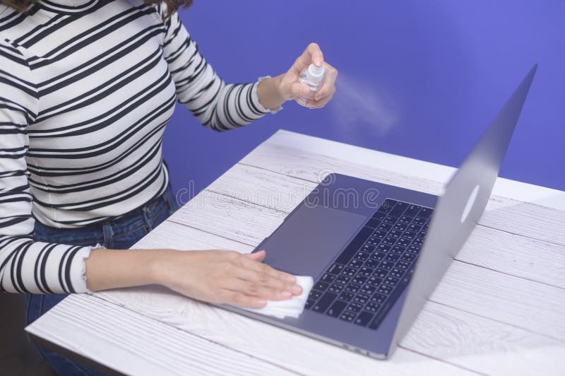 Young Woman Sanitizing Alcohol Spray with Computer , Covid-19 ...