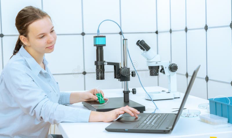 Young Woman in Science Lab Explore Lab on Chip Device Working with ...