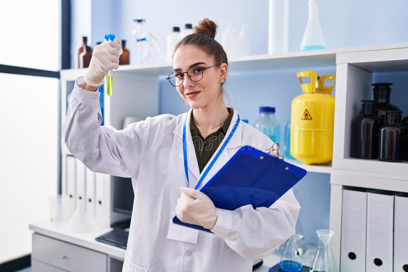 Young Woman Scientist Measuring Liquid at Laboratory Stock Image ...