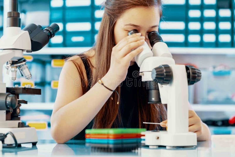 Young Woman Scientist Working with Microscope in Laboratory Stock Image ...