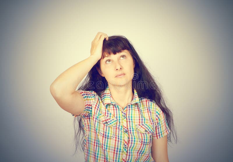 Young Woman Scratching Head, Thinking Daydreaming Deeply about Stock ...