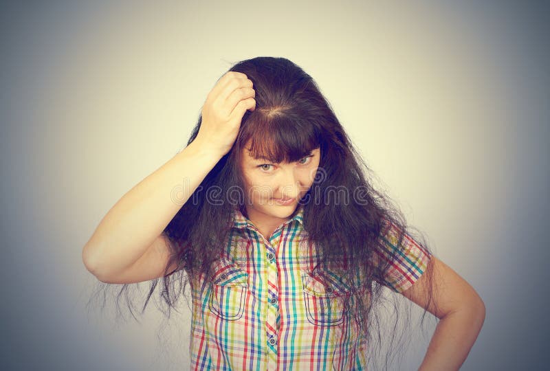 Young Woman Scratching Head, Thinking Daydreaming Deeply about Stock ...