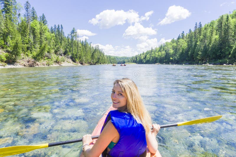 Young woman sea kayaking stock photo. Image of nautical - 99075676