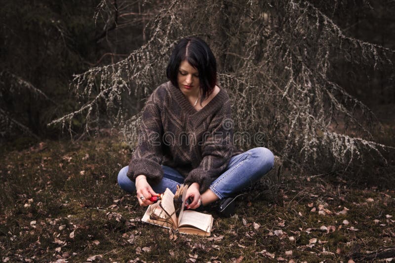 Young Woman Sets Fire To a Book Stock Image - Image of fashion, person ...