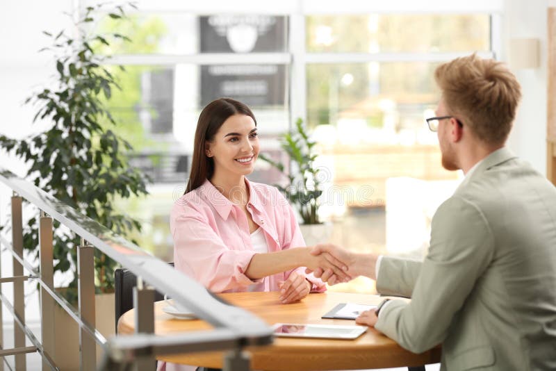 Young Woman Shaking Hands with Insurance Agent Stock Photo - Image of ...