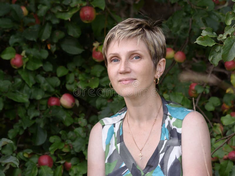Young Woman with Short Hair beside an Apple Tree Stock Image - Image of ...