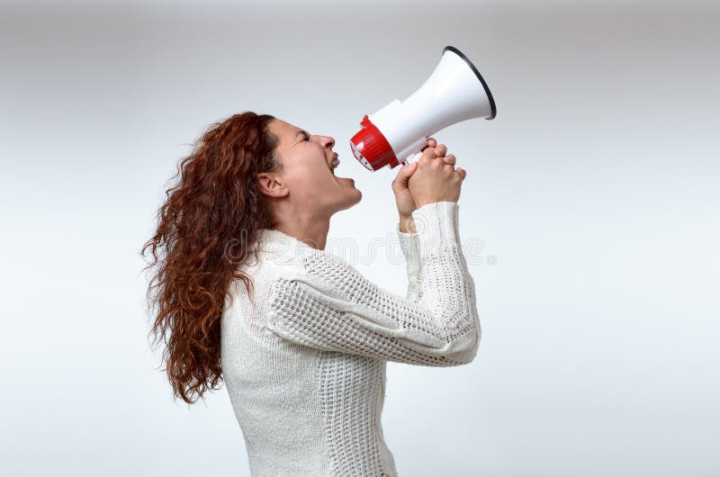 Young Woman Shouting into a Megaphone Stock Photo - Image of message ...