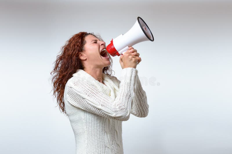 Young Woman Shouting into a Megaphone Stock Photo - Image of ...