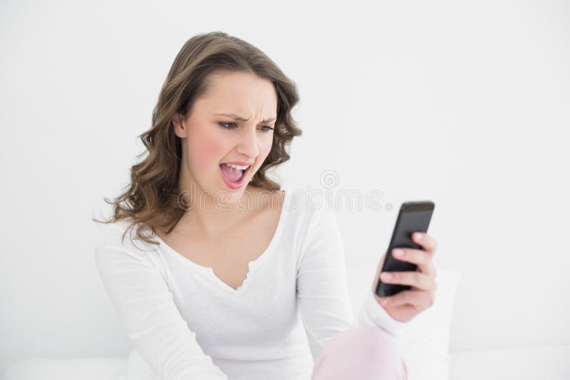 Young Woman Shouting into Mobile Phone Stock Photo - Image of open ...