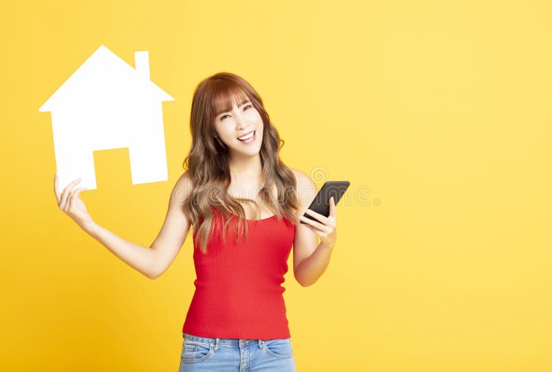 Woman Showing House Sign and Using Smart Phone Stock Photo - Image of ...