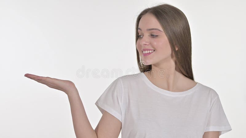 Young Woman Showing Product on Hand, White Background Stock Image ...