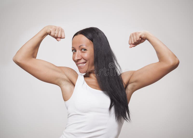 Young Woman Showing What Her Arm Muscles Stock Image - Image of happy ...