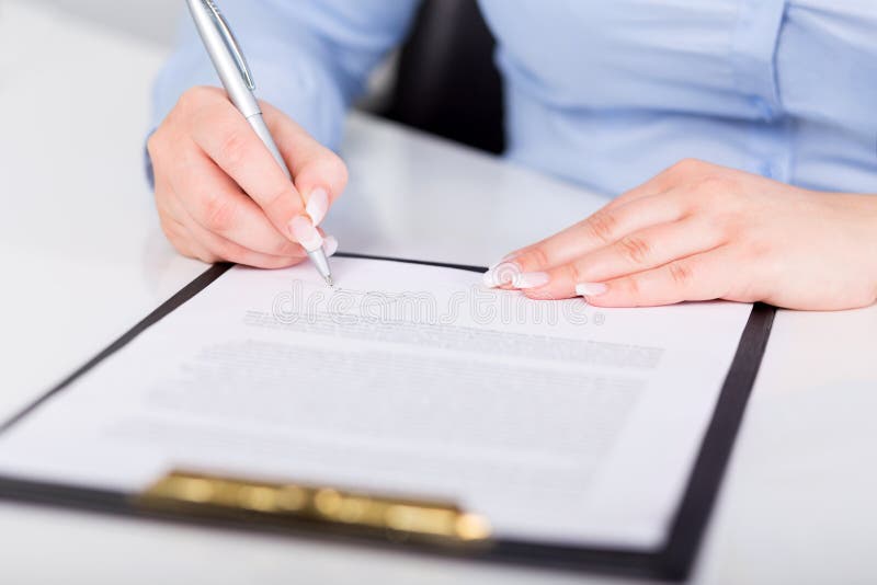 Young Woman Signs a Contract Stock Image - Image of contract, hand ...