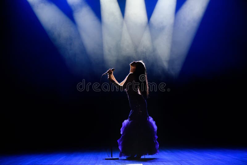 A Young Woman Singer on Stage during a Concert. Stock Image - Image of ...