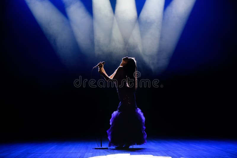 A Young Woman Singer on Stage during a Concert. Stock Image - Image of ...