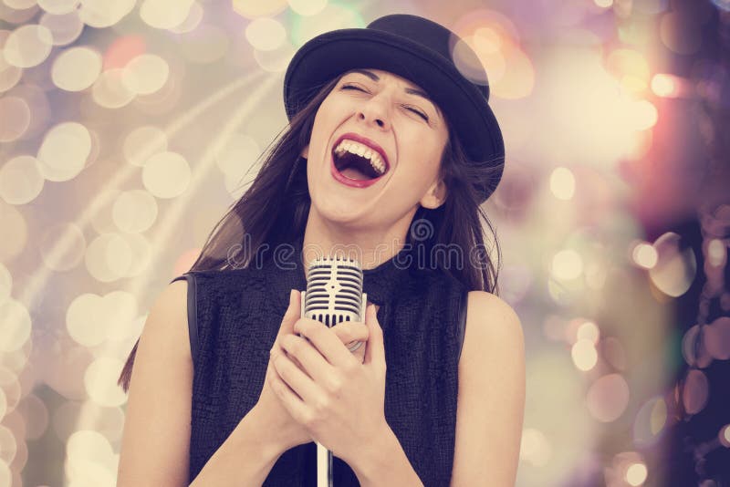 Young Woman Singing with the Microphone Stock Image - Image of glamour ...