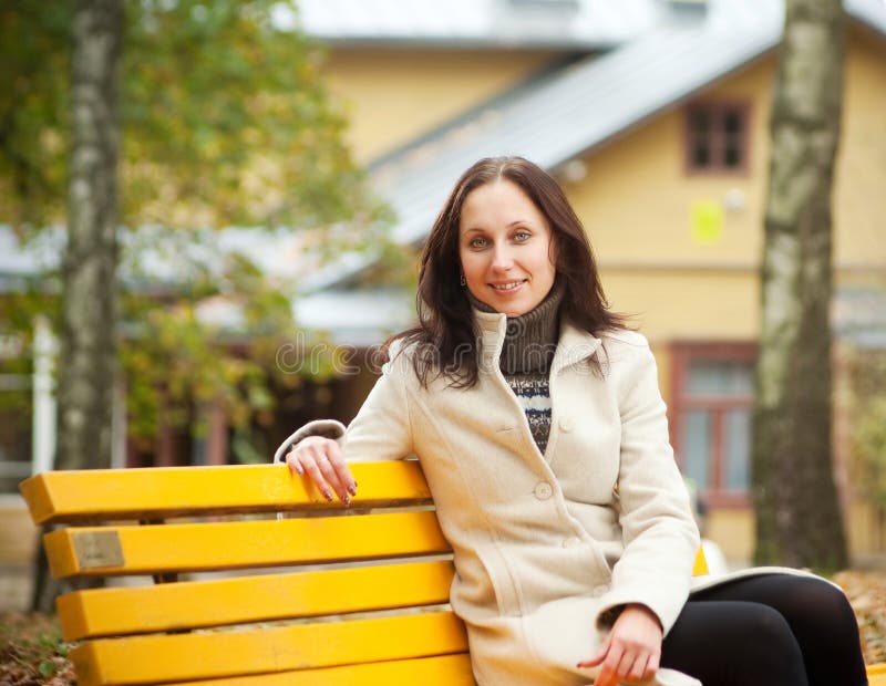 Young Woman Sitting on Bench Stock Image - Image of happiness, bench ...