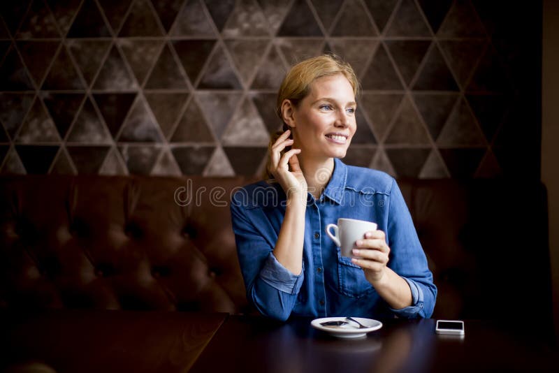 Young Woman Sitting in Cafe Stock Photo - Image of attractive ...