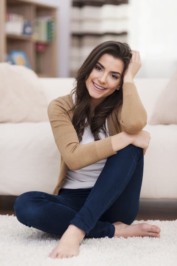 Young Woman Sitting on Carpet Stock Image - Image of camera, carpet ...