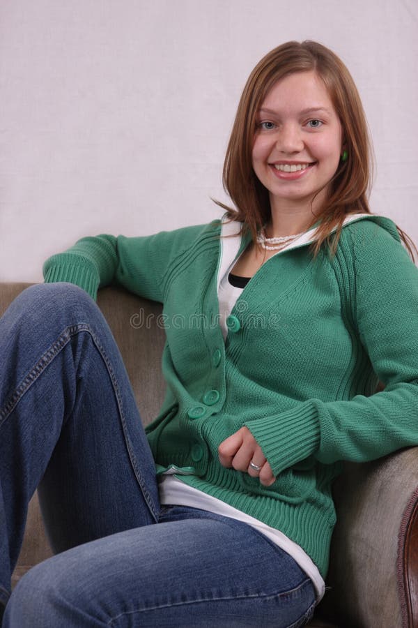 Young Woman Sitting in a Chair Stock Image - Image of relaxed, adult ...
