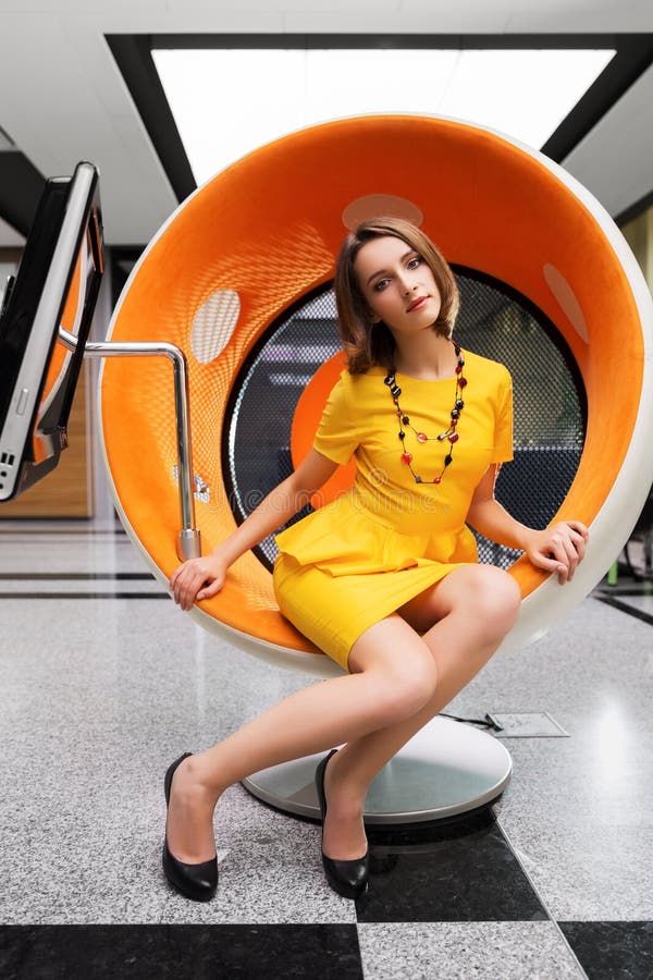 Young Woman Sitting on Computer Chair Stock Photo - Image of face ...