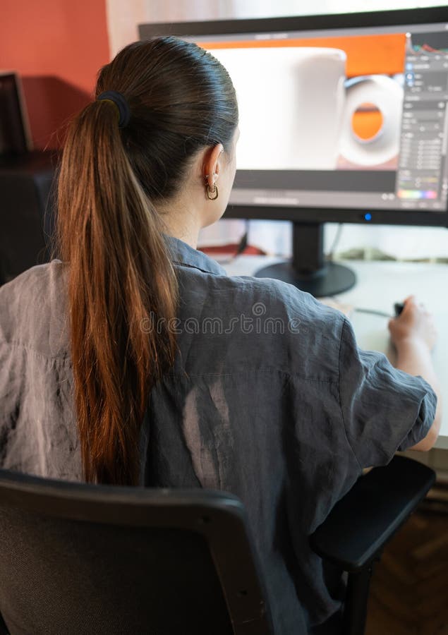 A Young Woman is Sitting at a Computer in the Office Stock Image ...